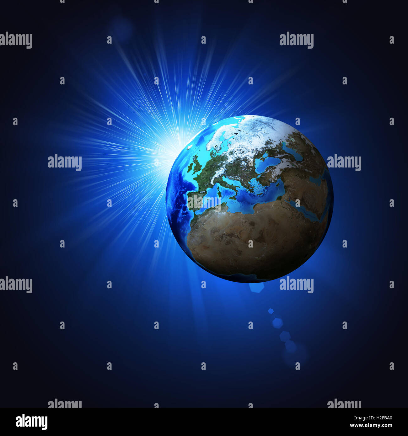 Earth planet in sun rays Stock Photo - Alamy