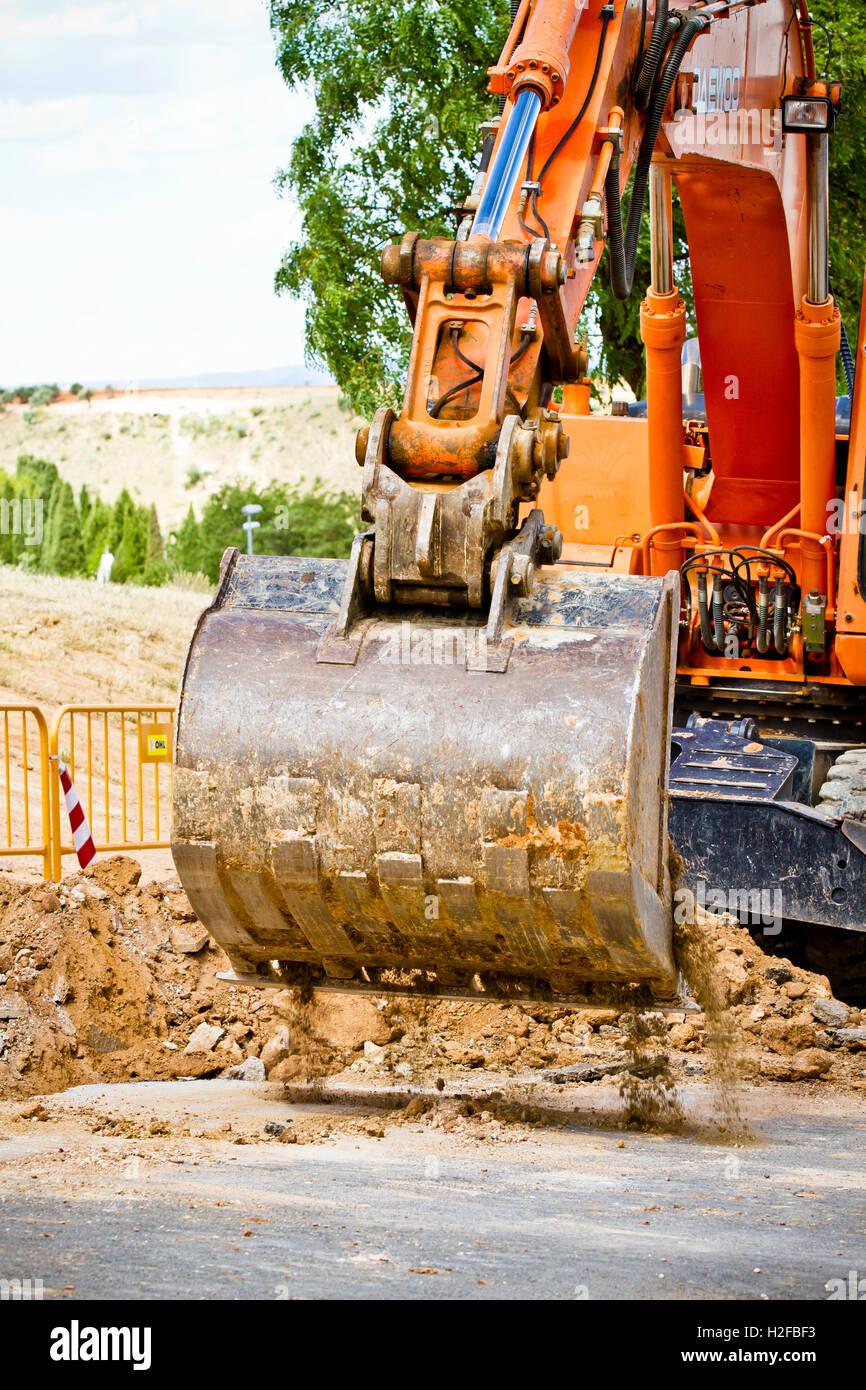 Loader Excavator standing in quarry with risen bucket over cloud Stock ...