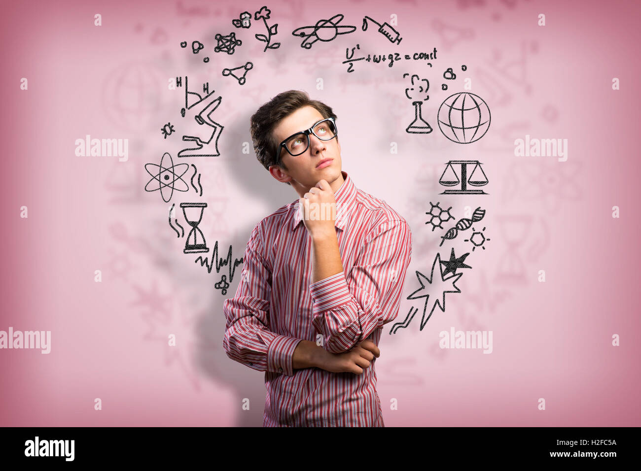 young man scientist with glasses thinking Stock Photo - Alamy