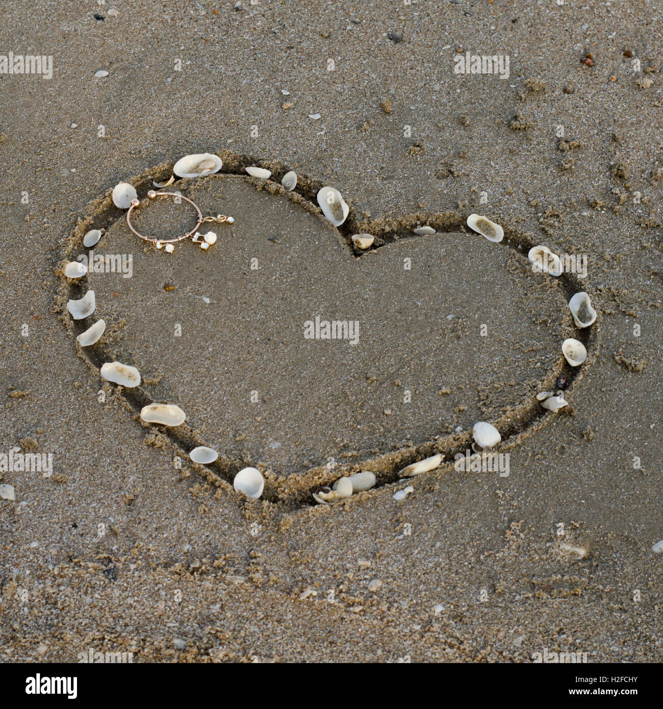 a heart on the sand in the beach Stock Photo - Alamy
