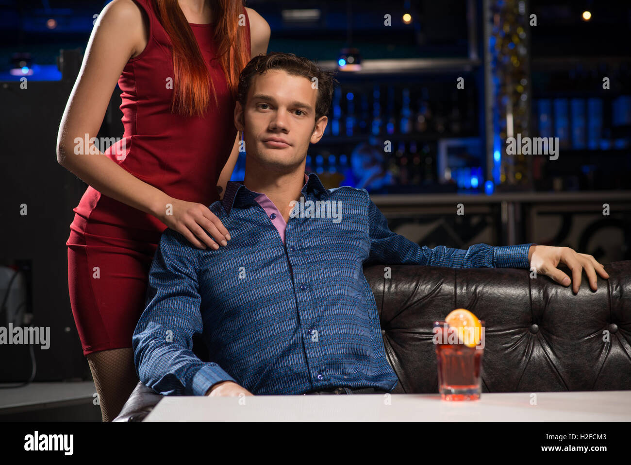 Portrait of a successful man in a nightclub Stock Photo - Alamy