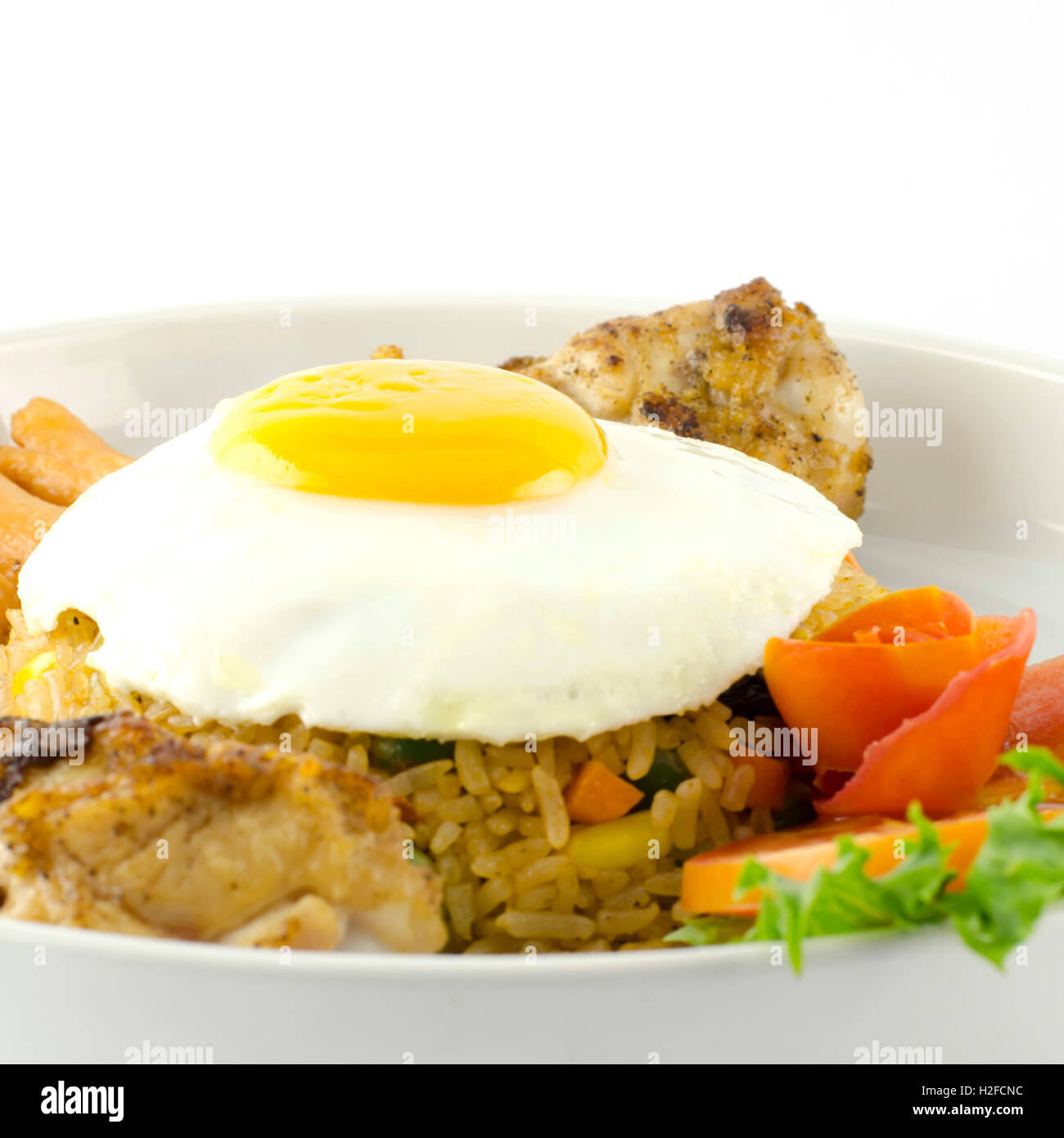 American fried rice isolated on white Stock Photo - Alamy