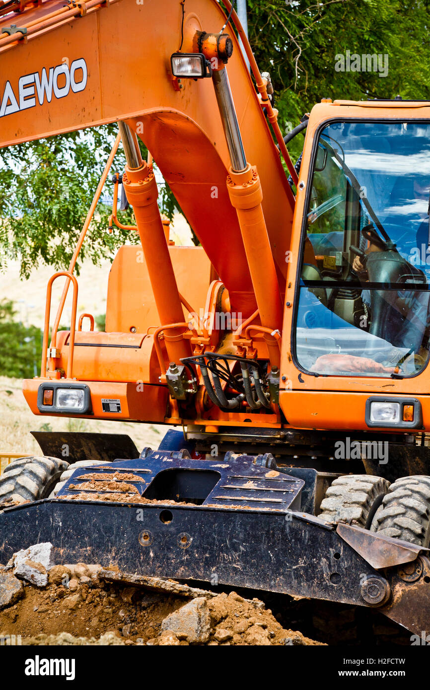 Public street maintenance works, excavator Stock Photo - Alamy