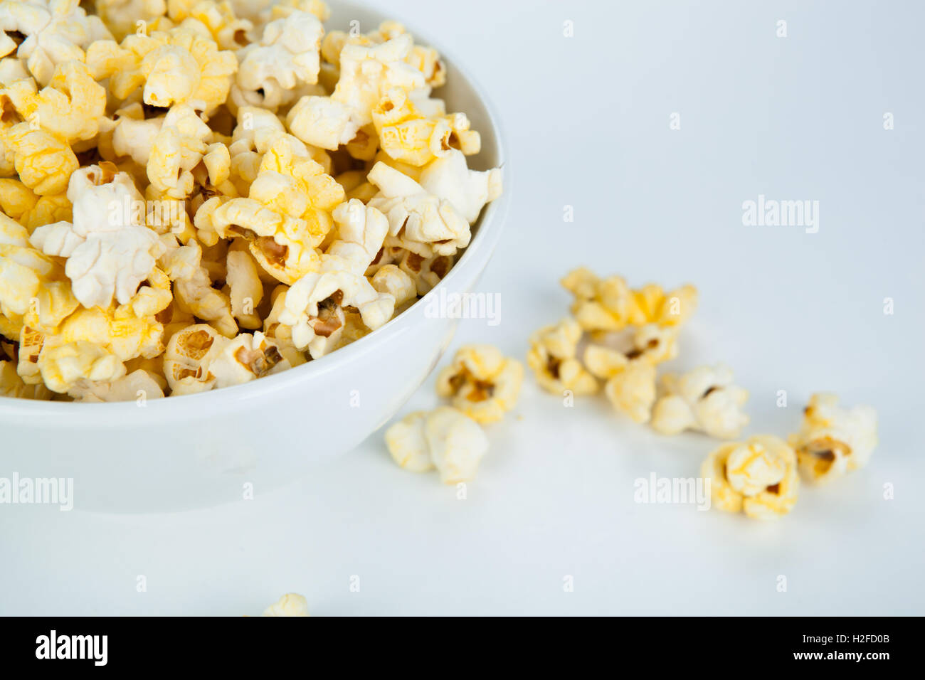 lots of popcorn on white Stock Photo - Alamy