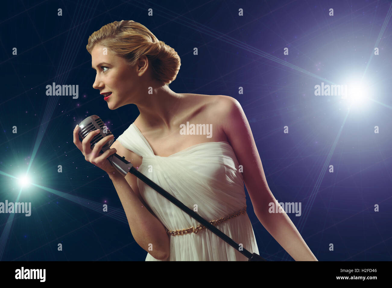 attractive female singer with microphone Stock Photo - Alamy