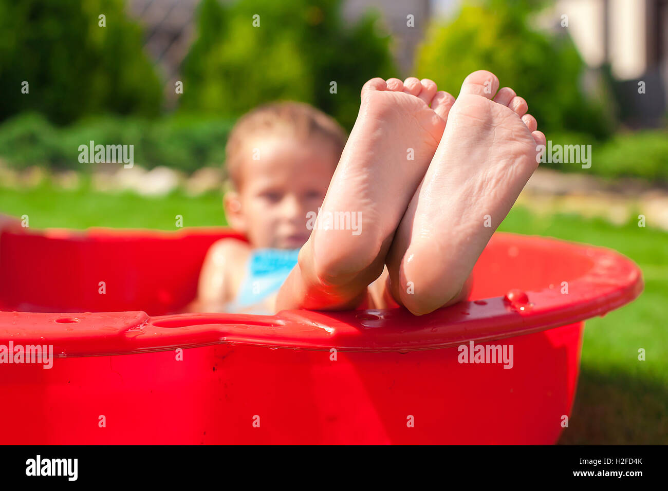 closeup-of-little-kid-s-legs-in-small-red-pool-stock-photo-alamy