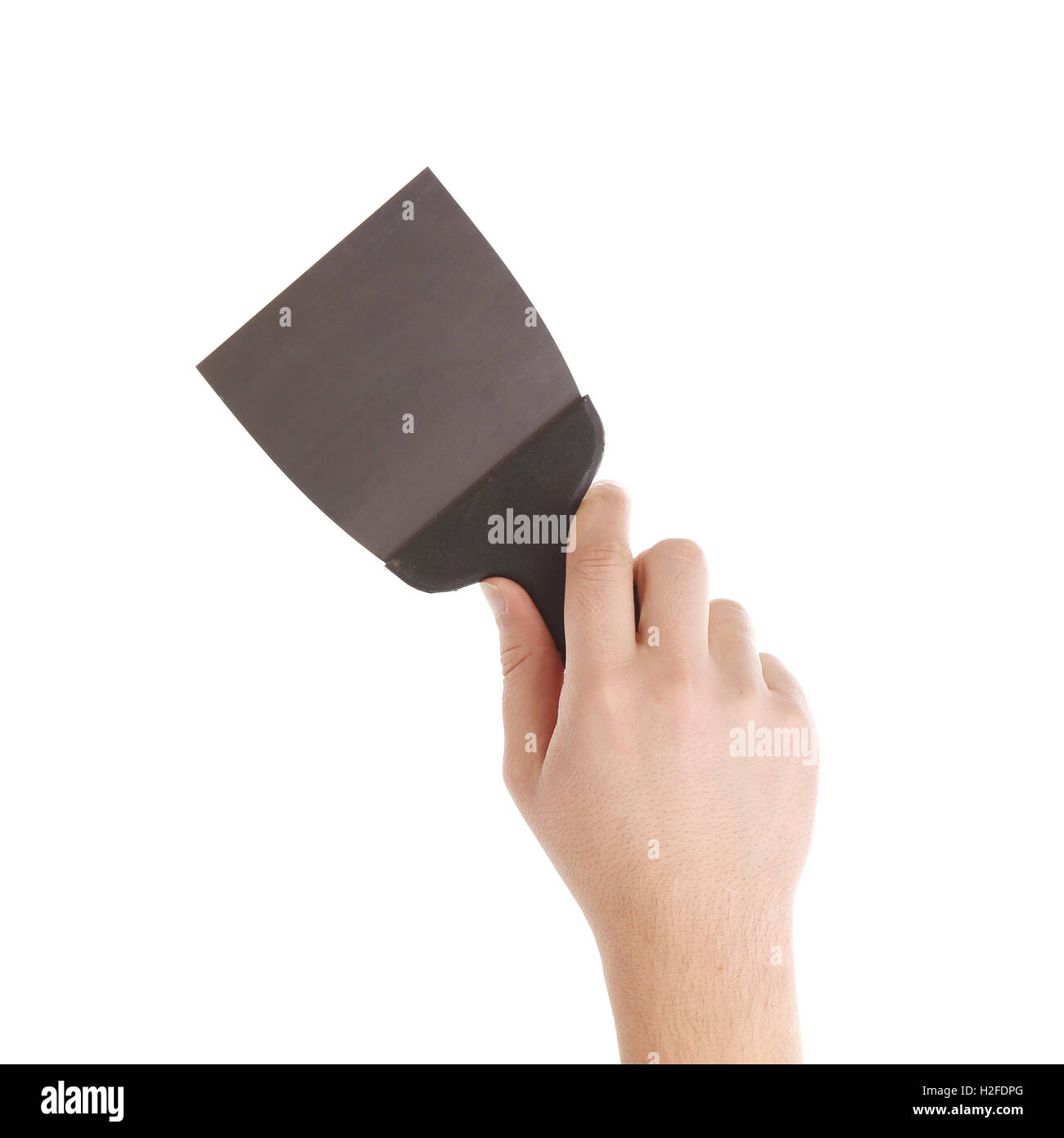 Hand holds construction spatula Stock Photo - Alamy