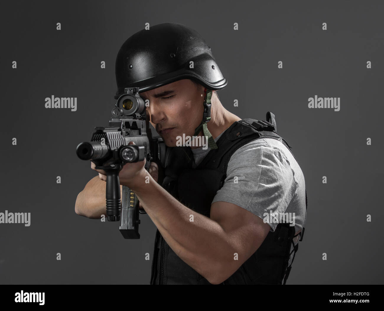 paintball sport player wearing protective helmet aiming pistol Stock ...