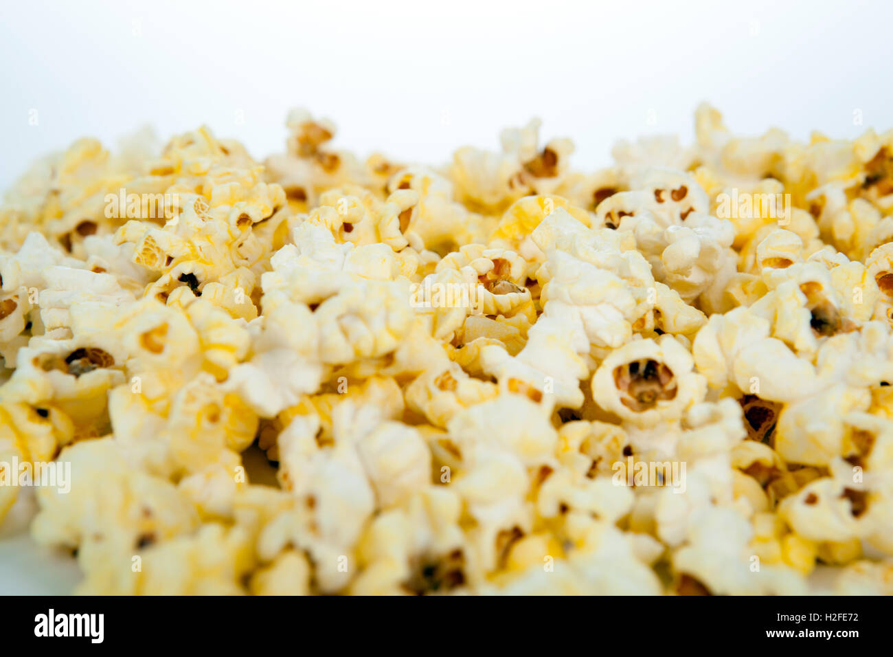 lots of popcorn on white Stock Photo - Alamy