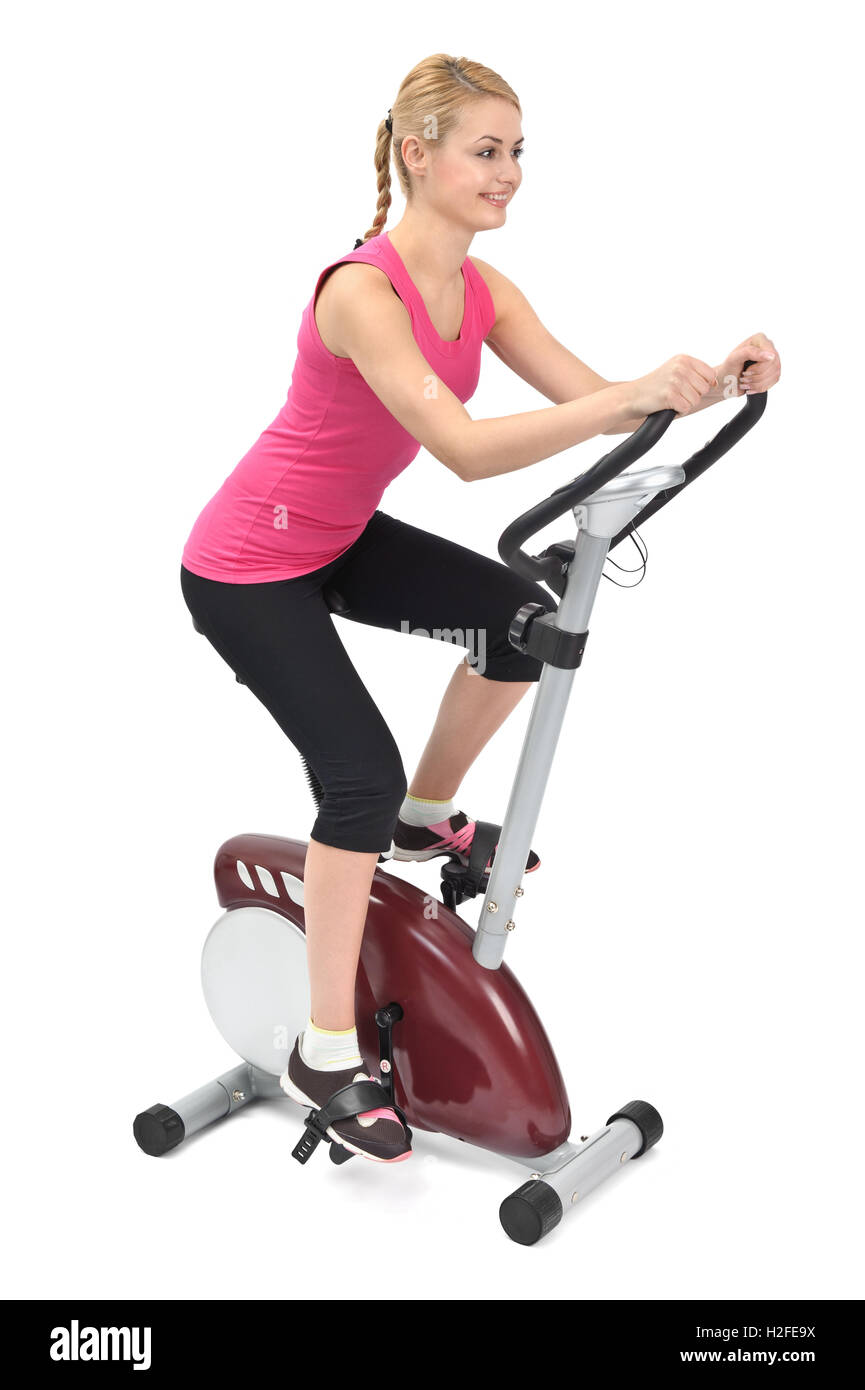 young woman doing indoor biking exercise Stock Photo - Alamy
