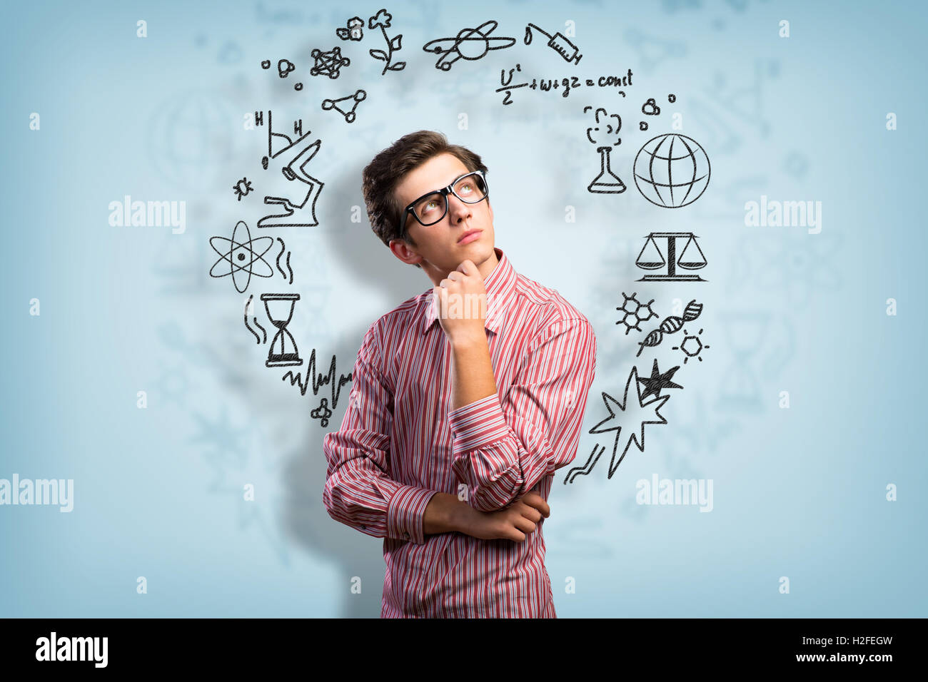 young man scientist with glasses thinking Stock Photo - Alamy