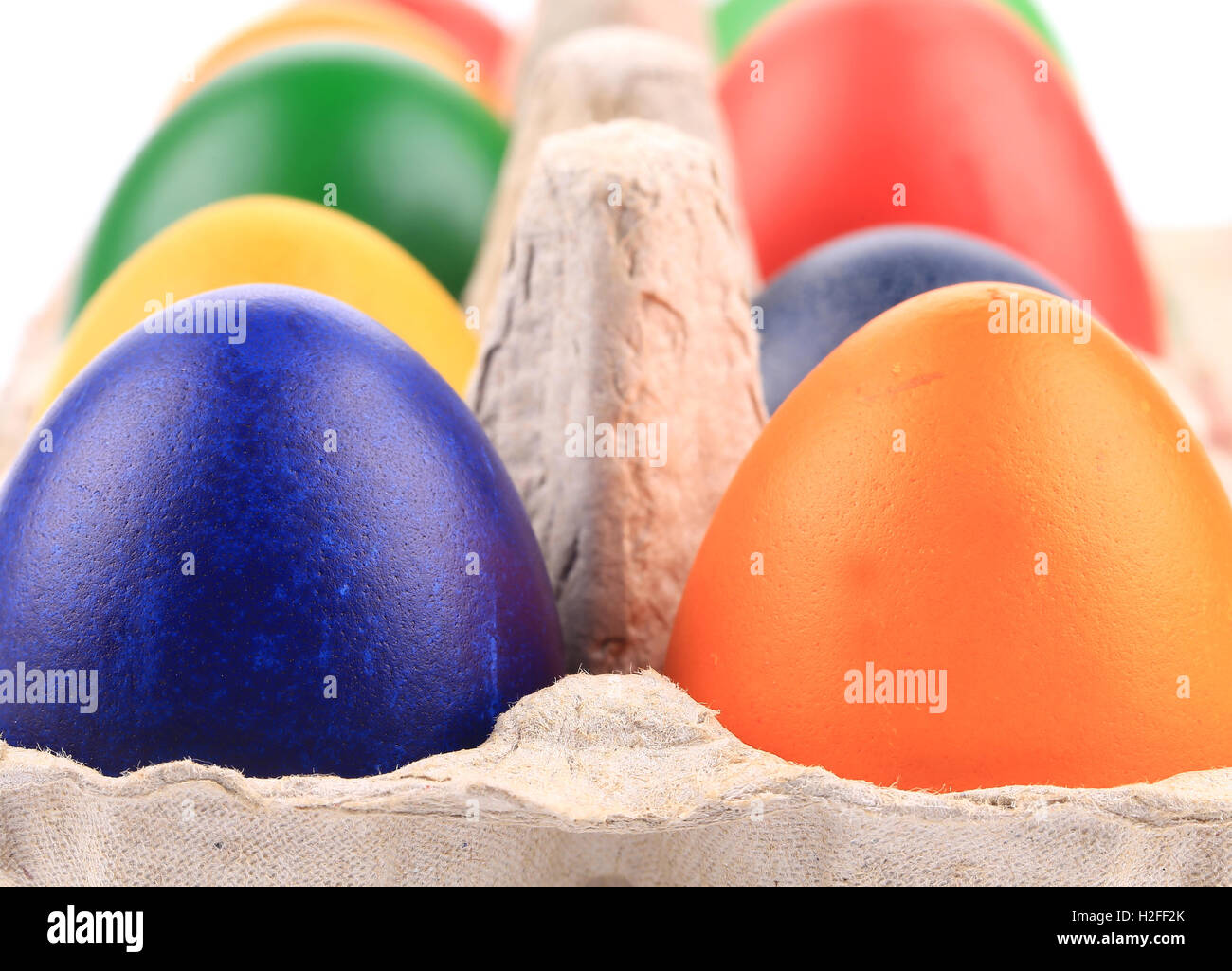 Cardboard egg box with colorful eggs Stock Photo - Alamy