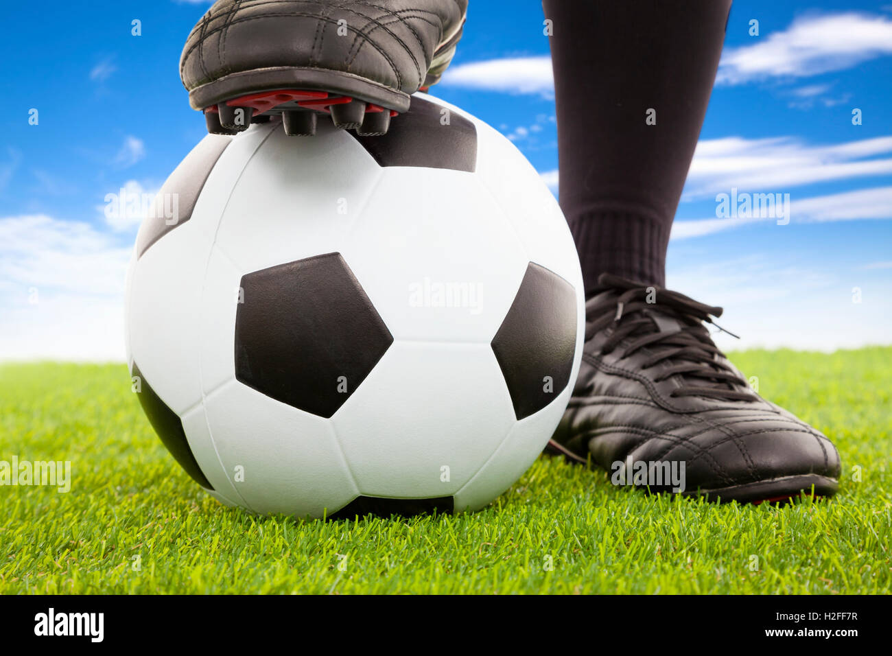 Soccer player's feet in casual pose on an open playing field Stock ...