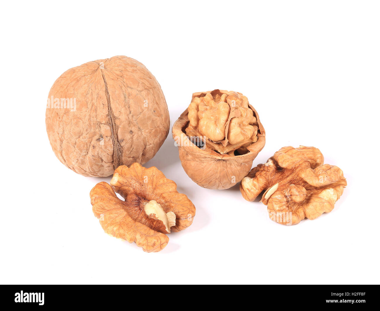 Crushed walnuts on white background Stock Photo - Alamy