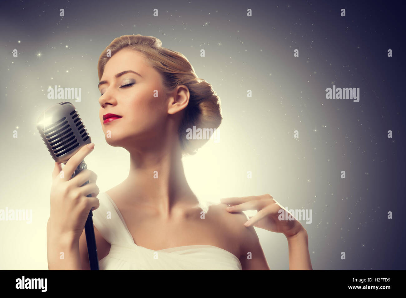 attractive female singer with microphone Stock Photo - Alamy