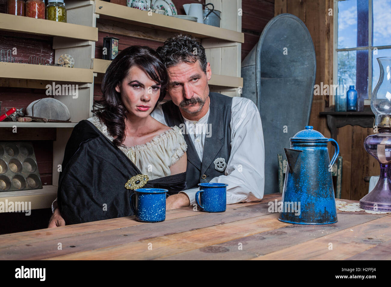 Serious Western Sheriff and Woman Pose Inside House Stock Photo - Alamy