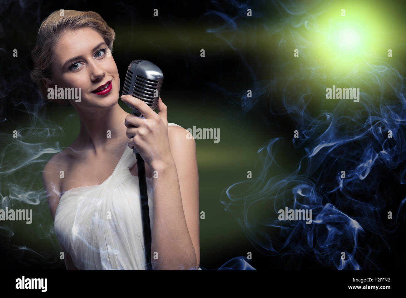 attractive female singer with microphone Stock Photo - Alamy