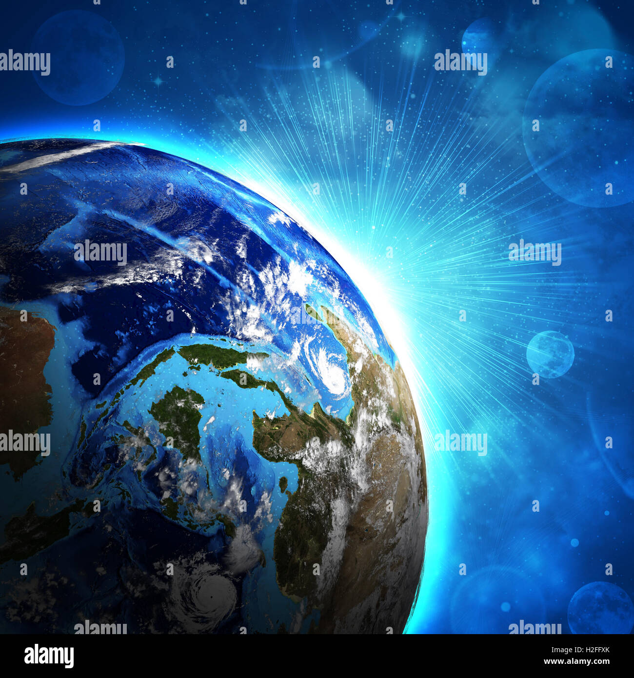 Earth planet in sun rays Stock Photo - Alamy
