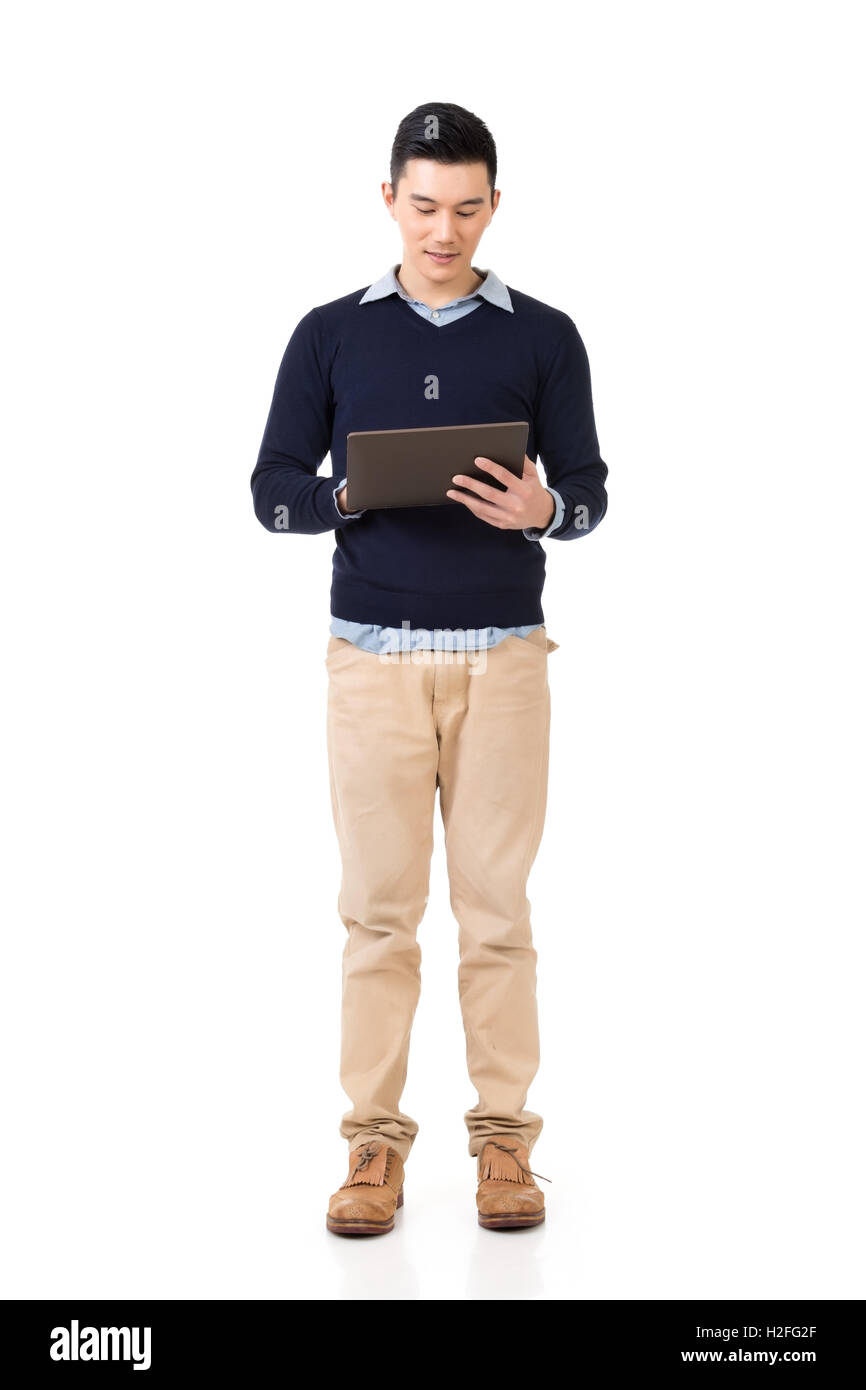Asian man using pad Stock Photo - Alamy