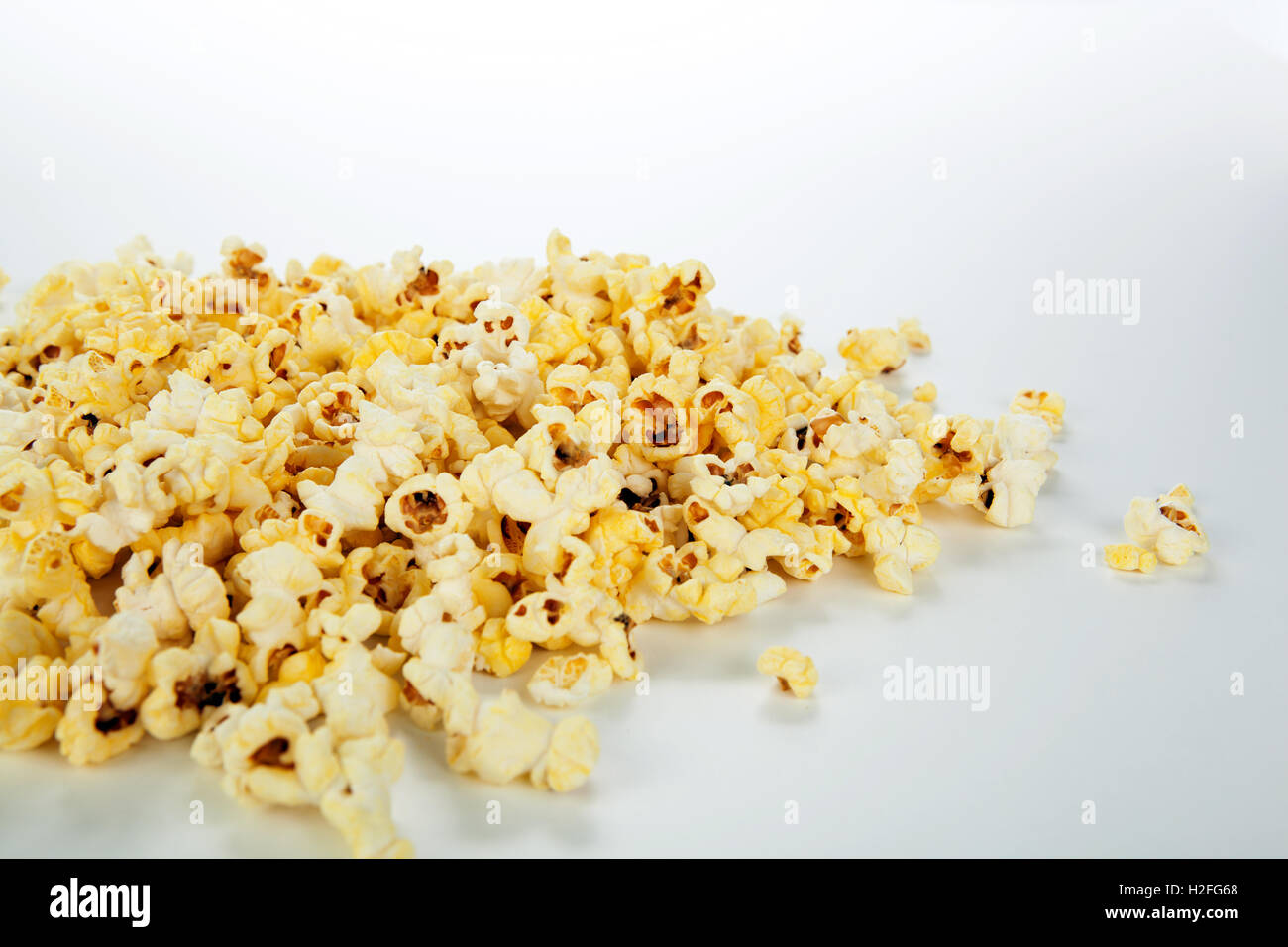 lots of popcorn on white Stock Photo - Alamy