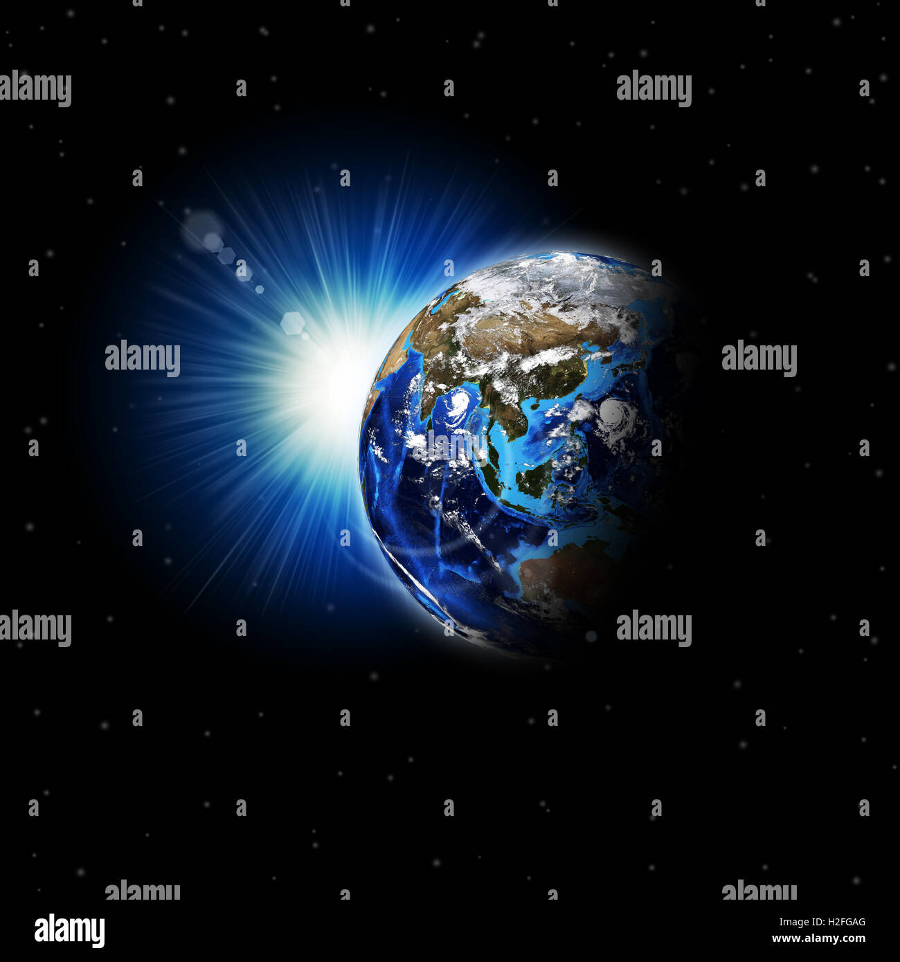 Earth planet in sun rays Stock Photo - Alamy
