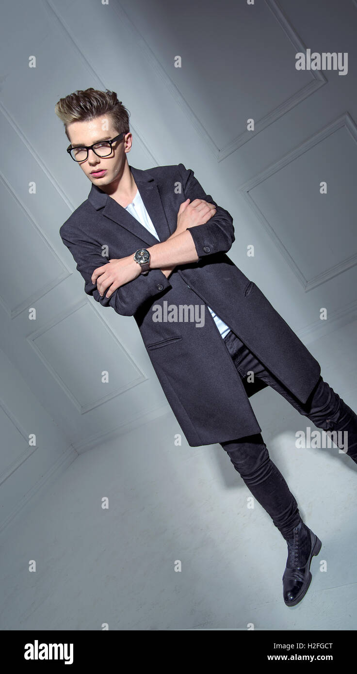 Portrait of a smart young man wearing trendy coat Stock Photo - Alamy