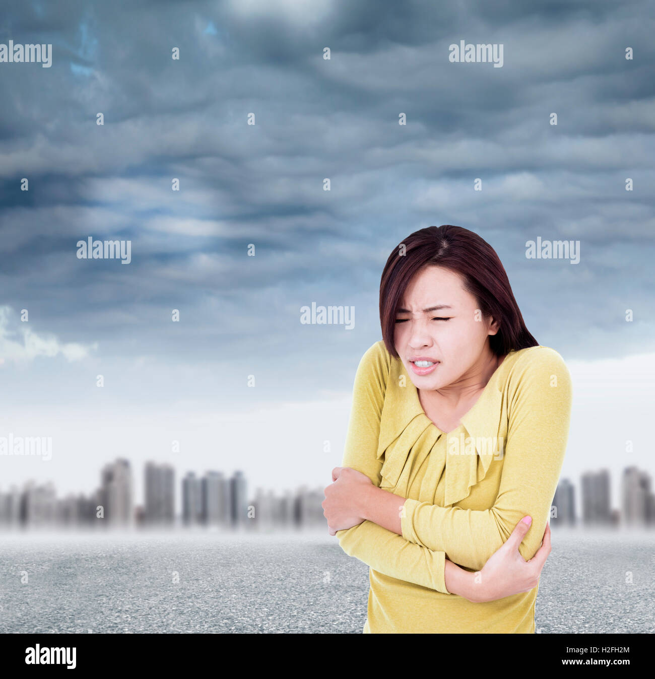 Young woman shudder and tightening body in outdoors Stock Photo - Alamy