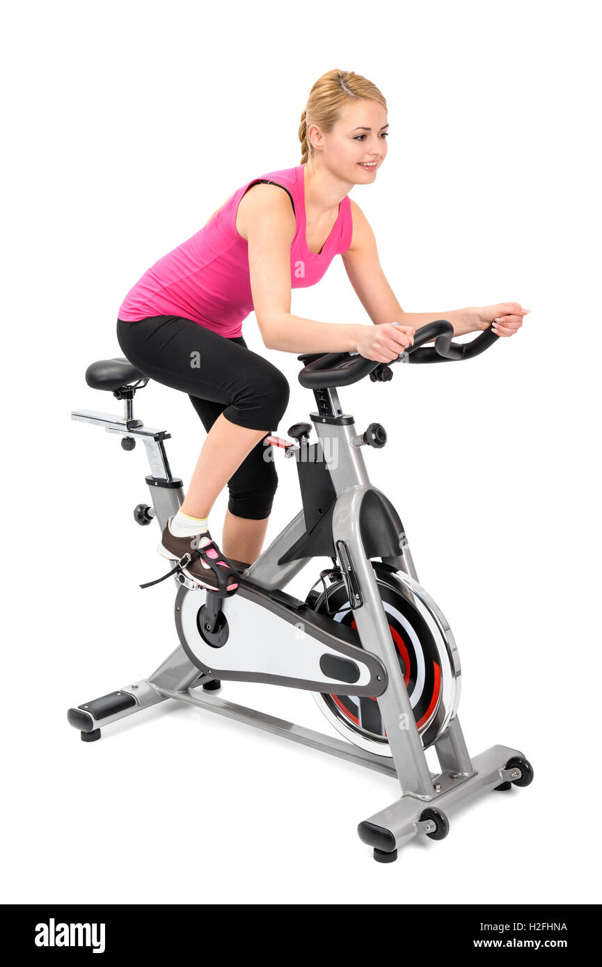 young woman doing indoor biking exercise Stock Photo - Alamy