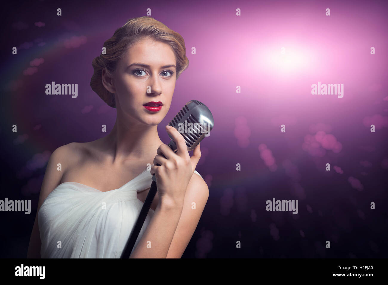 attractive female singer with microphone Stock Photo - Alamy