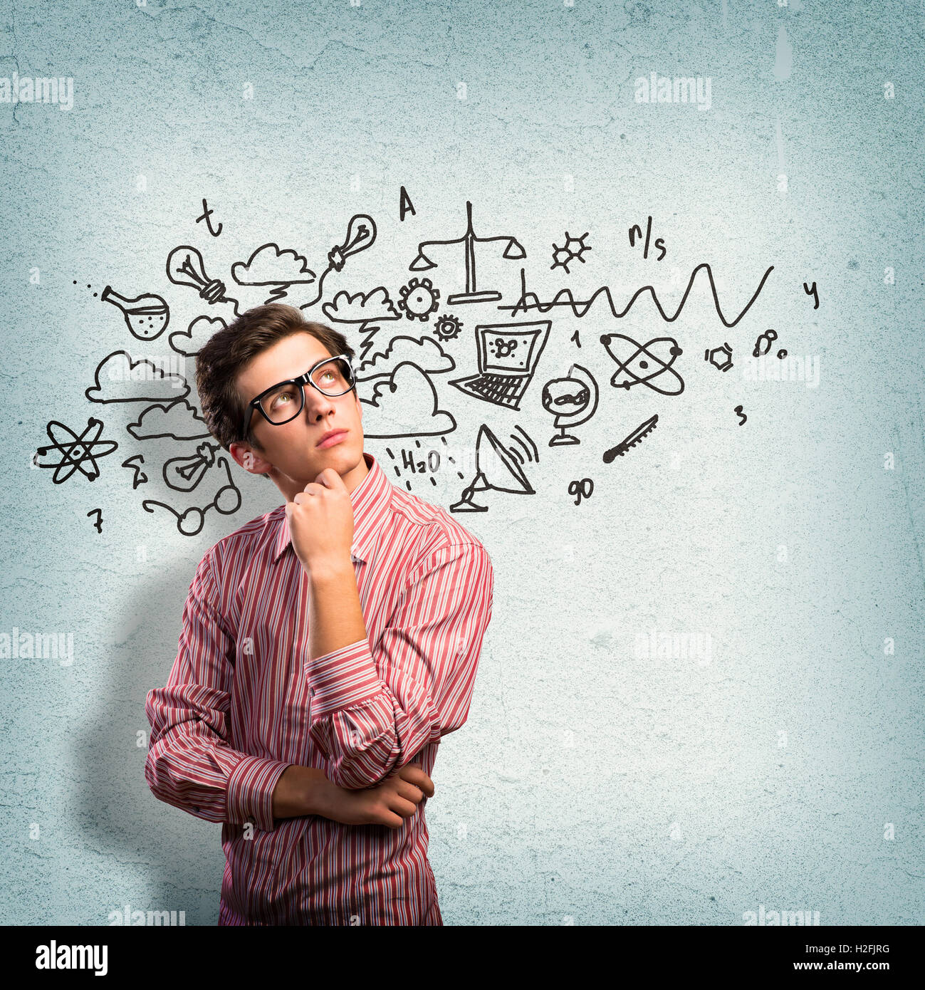 young man scientist with glasses thinking Stock Photo - Alamy