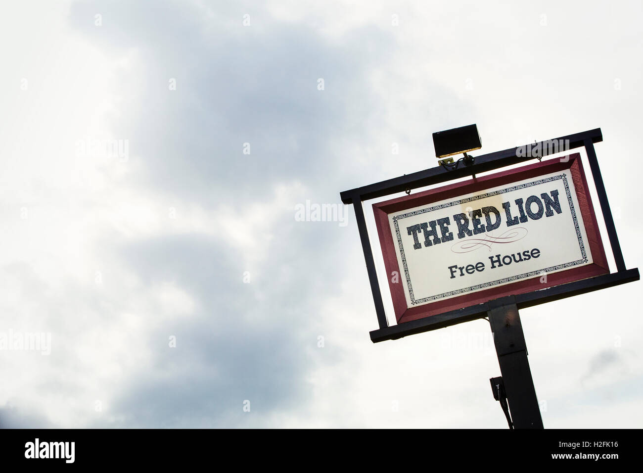 The Red Lion village public house pub sign outside the local pub Stock ...