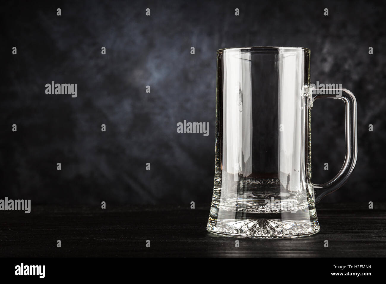 Beer mug on black background Stock Photo - Alamy