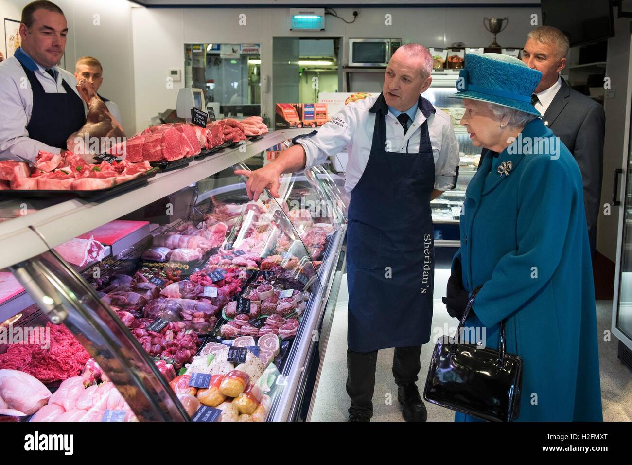 Queen Elizabeth II speaks with co-owners of HM Sheridan Butchers Mr ...