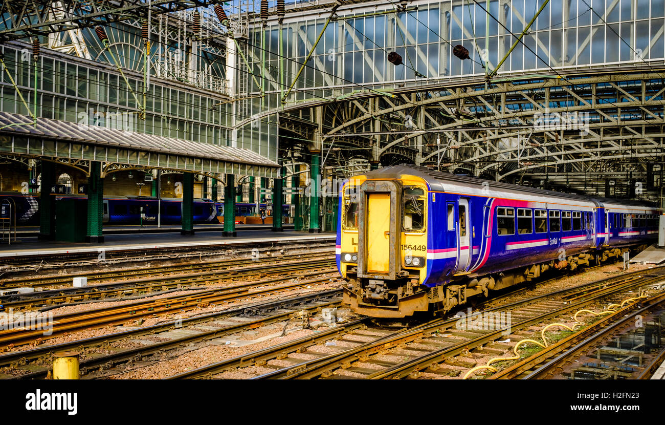 ScotRail passenger train departing from Central Station in Glasgow ...