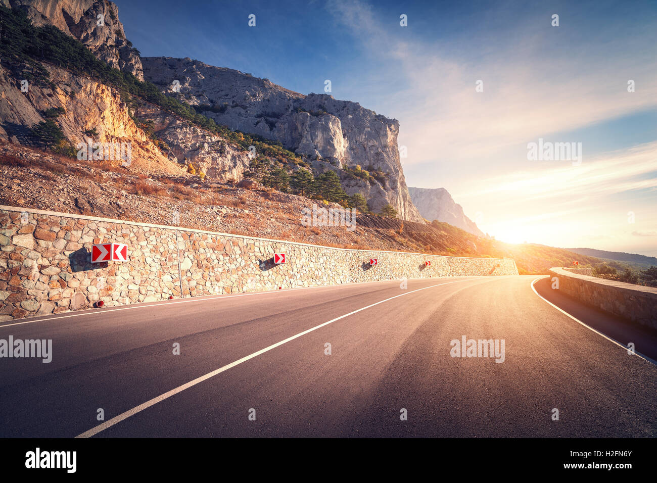 Asphalt road. Colorful landscape with beautiful mountain road with a ... Asphalt road. Colorful landscape with beautiful mountain road with a ...