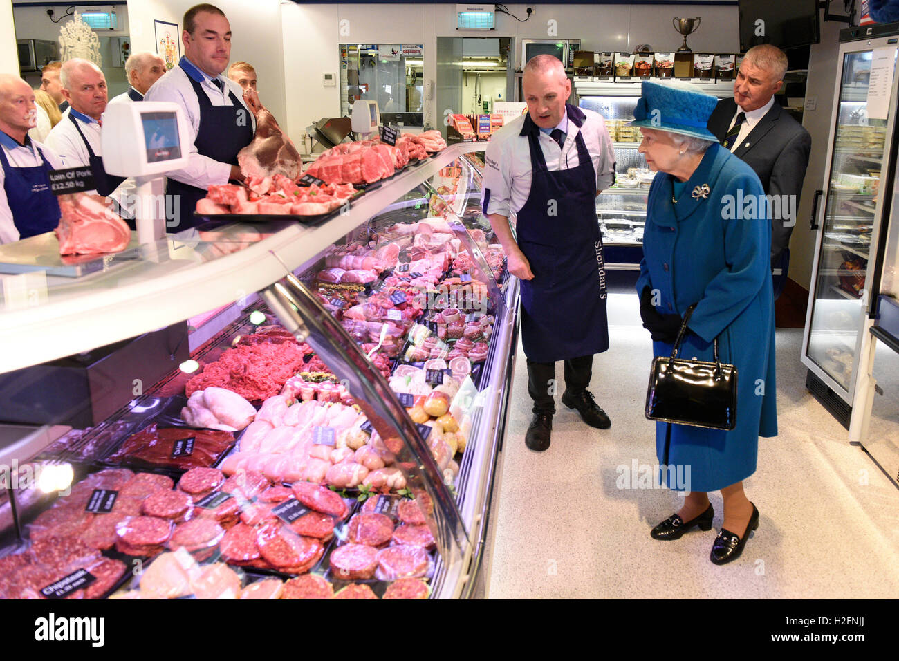 Queen Elizabeth II speaks with co-owners of HM Sheridan Butchers Mr ...