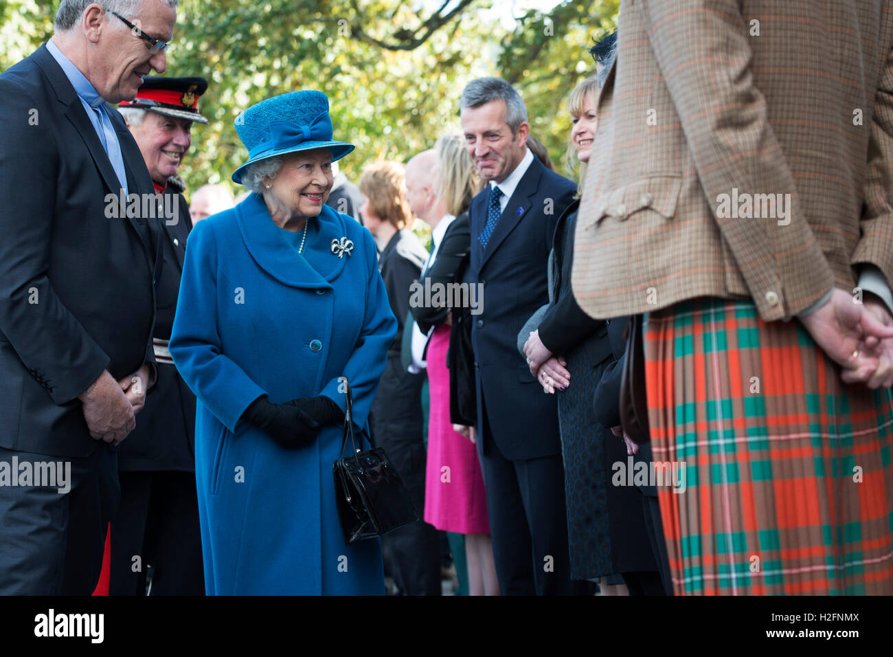 Queen Elizabeth II meets members of the local emergency services during ...