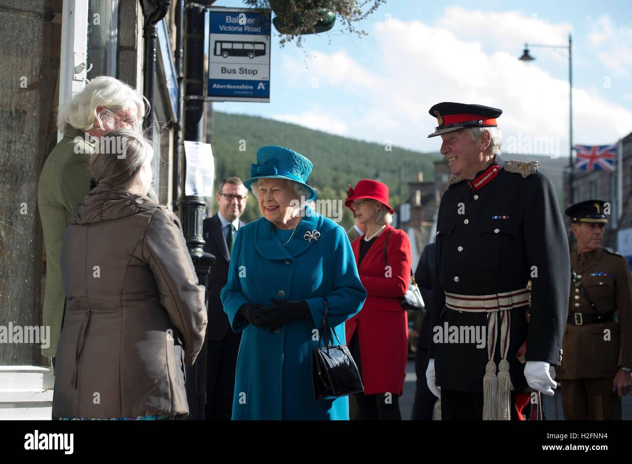 Queen Elizabeth II speaks with local people accompanied by The Lord ...