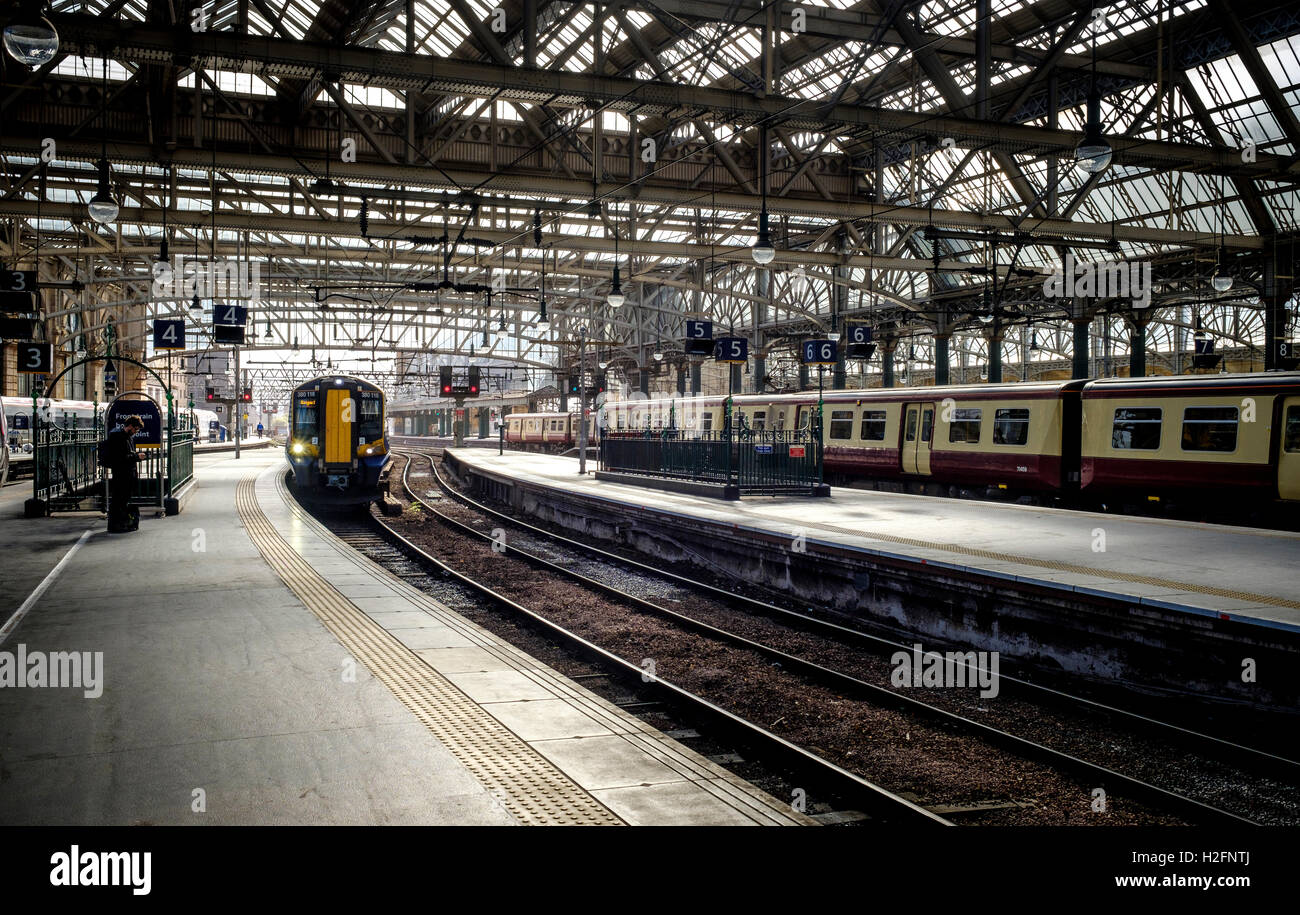 A local ScotRail commuter passenger train arriving at Central Station ...