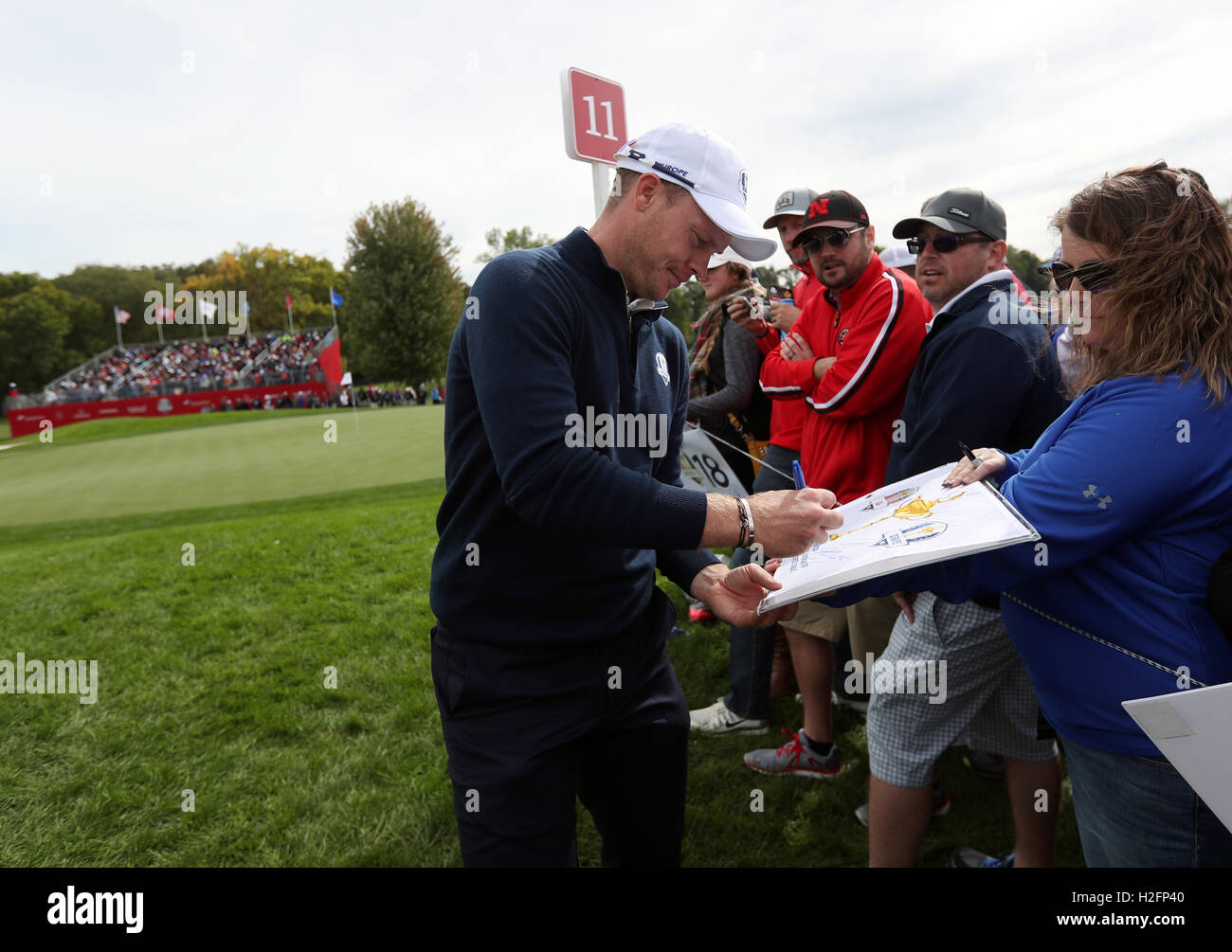 Europe's Danny Willett signs autographs for fans during a practice ...