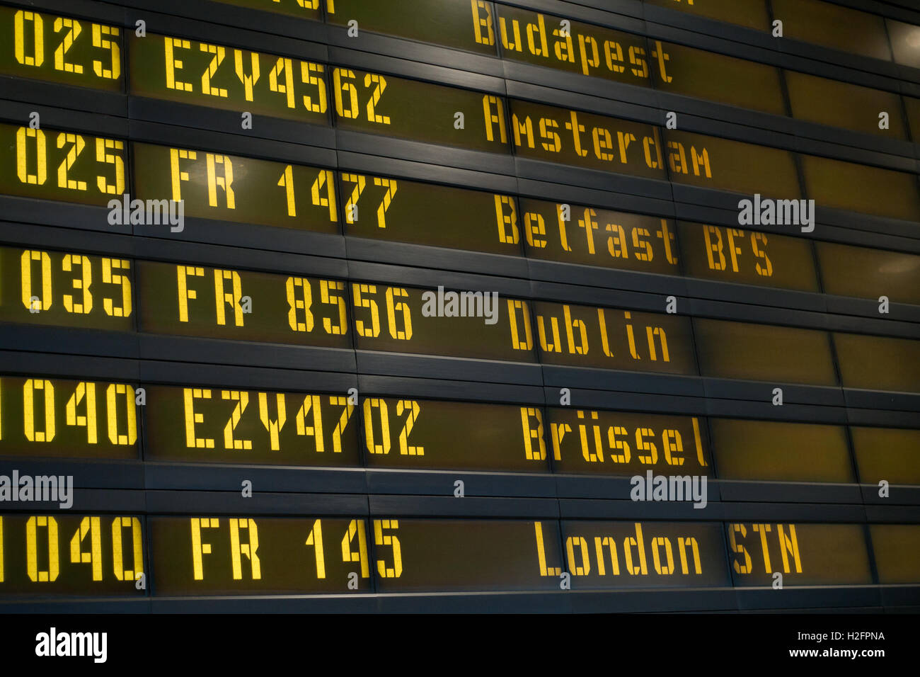 Timetable digital board at an airport Stock Photo - Alamy