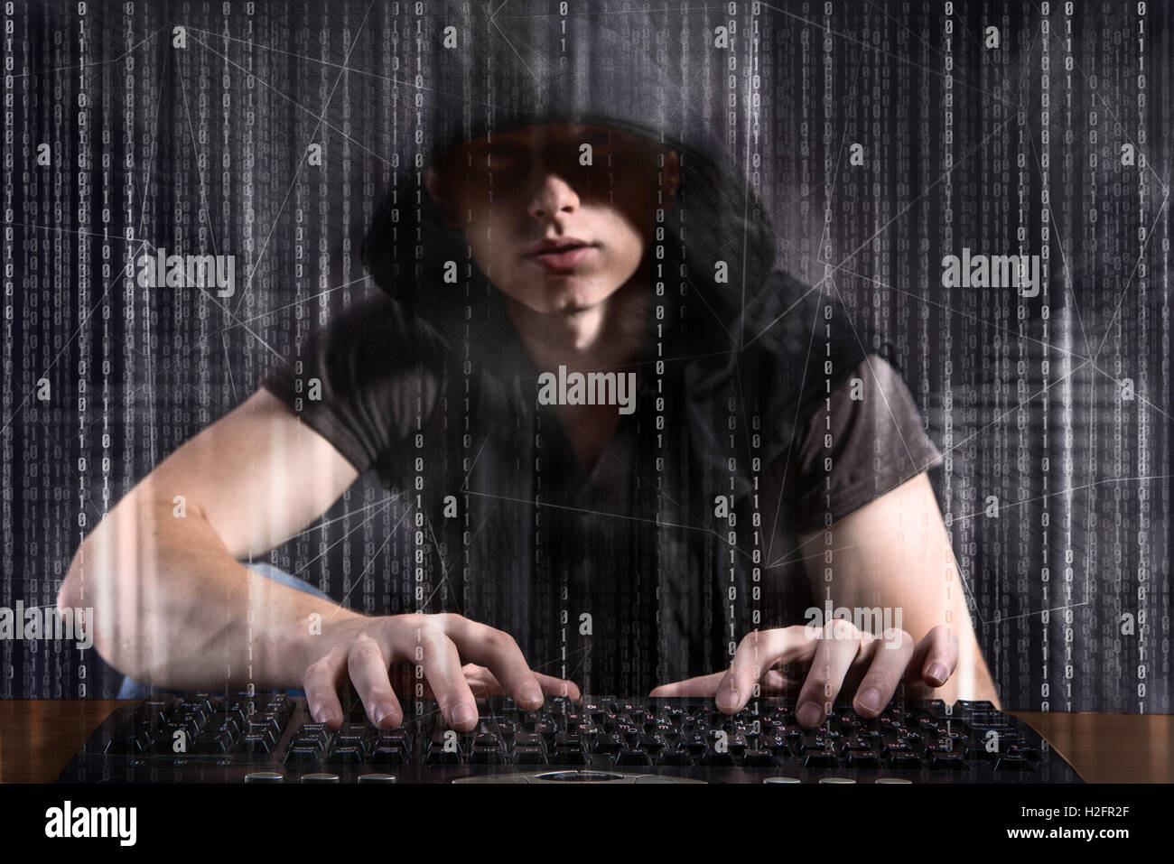 Young hacker in digital security concept Stock Photo - Alamy