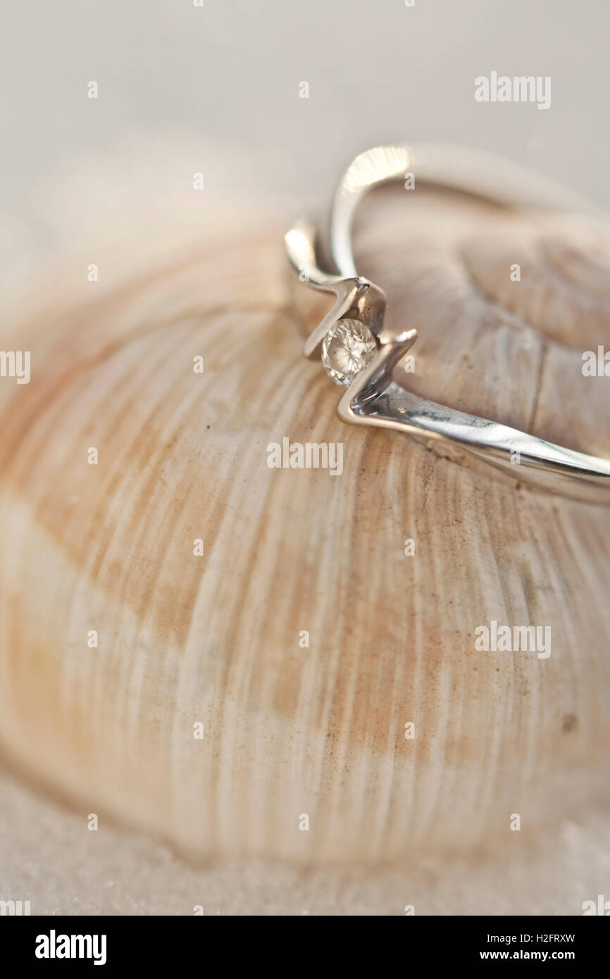 Beautiful engagement ring on a shell Stock Photo - Alamy