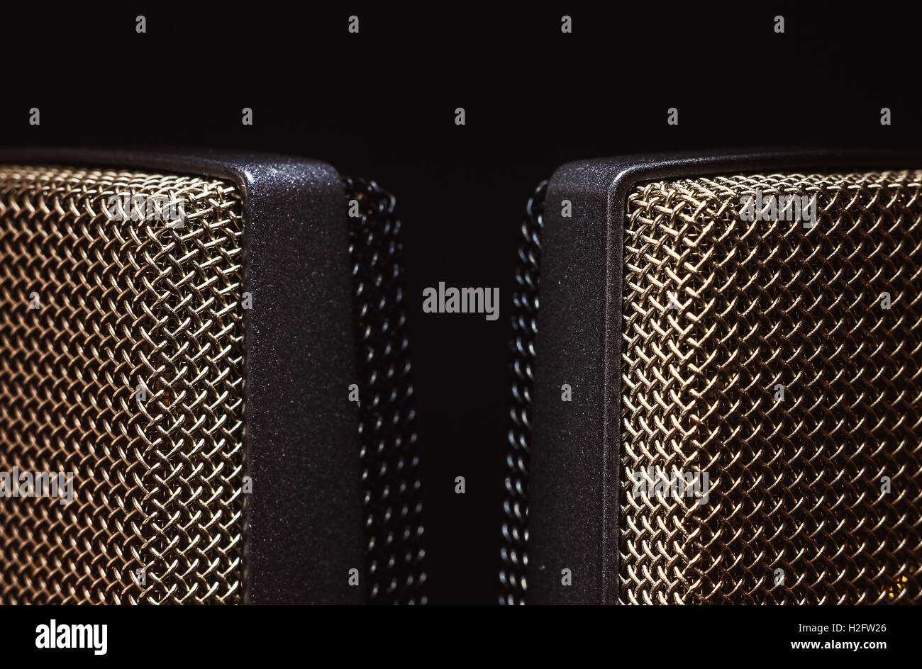 Details of two studio microphones, on black background Stock Photo - Alamy