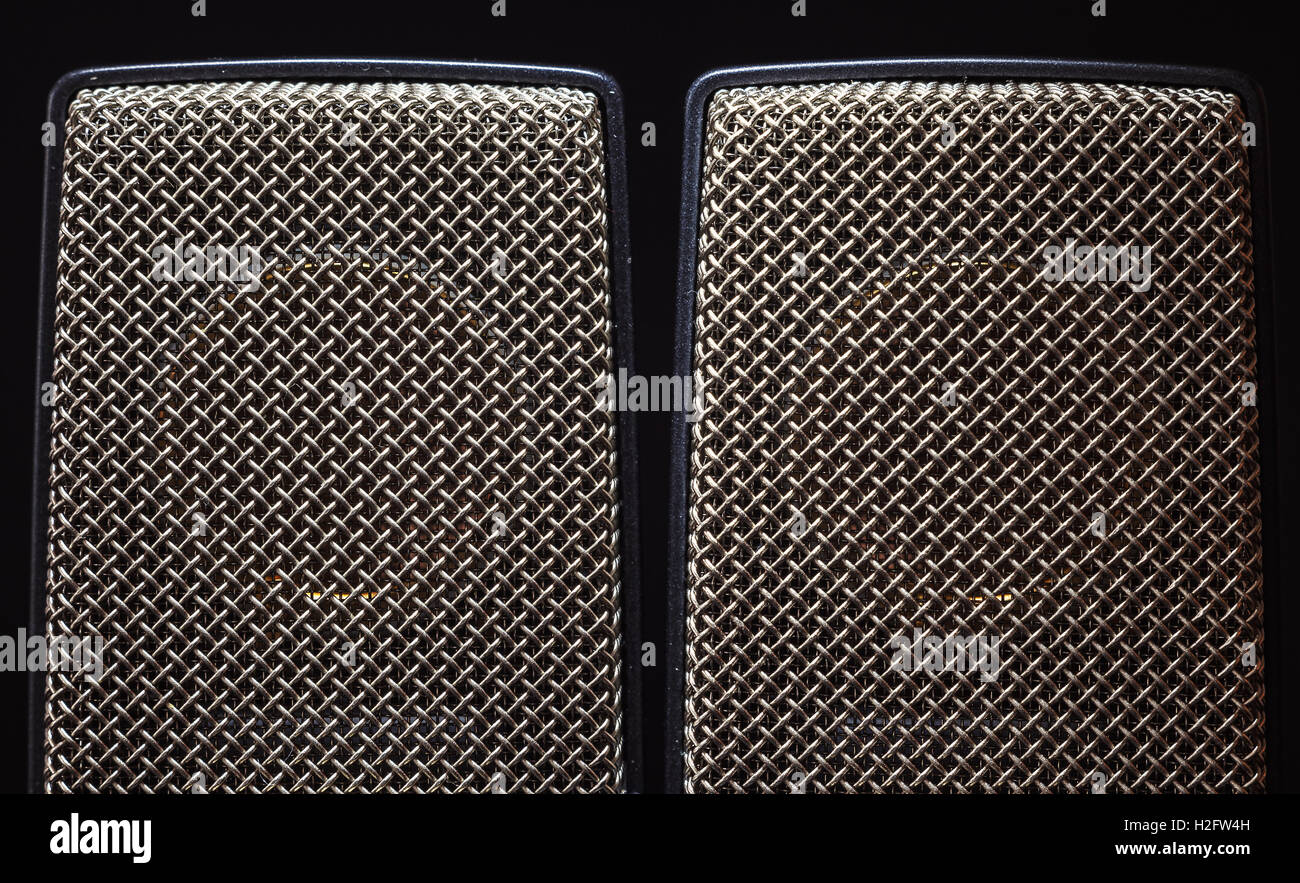 Details of two studio microphones, on black background Stock Photo - Alamy