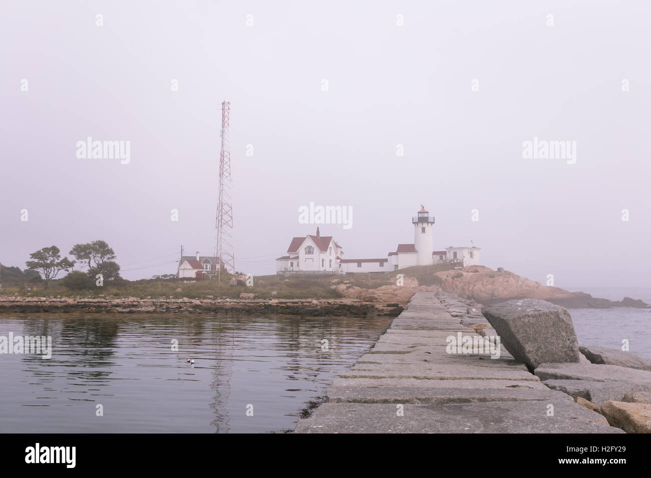 Eastern Point Lighthouse in Gloucester MA with fog rolling in Stock ...