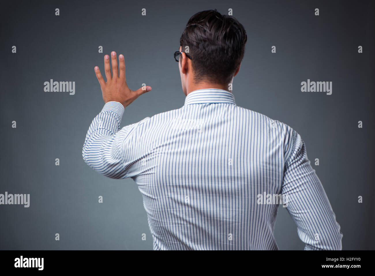 Handsome businessman pressing virtual buttons Stock Photo - Alamy Handsome businessman pressing virtual buttons Stock Photo - Alamy