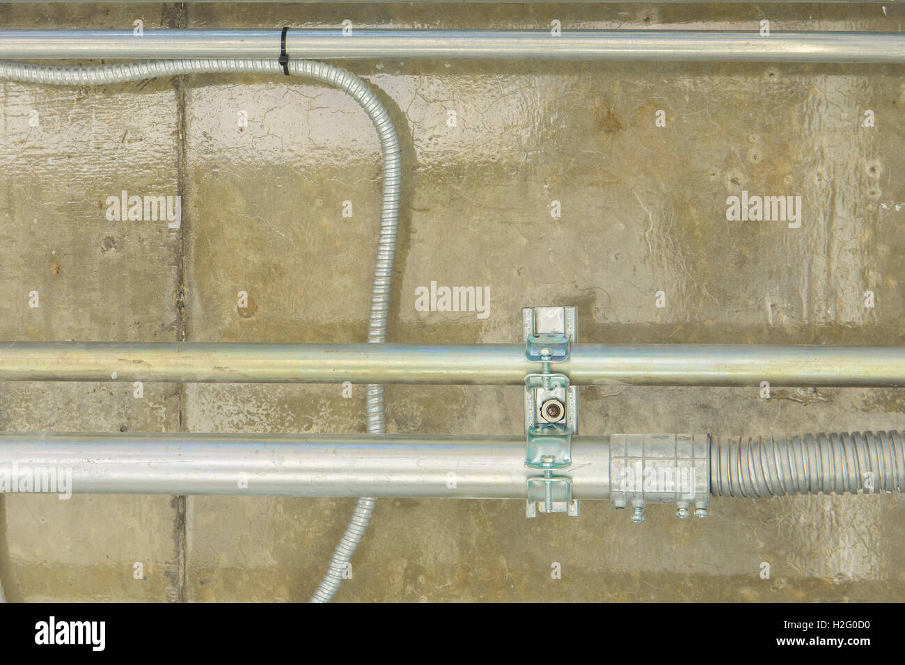 Metal pipes electrical distribution system installation Stock Photo - Alamy