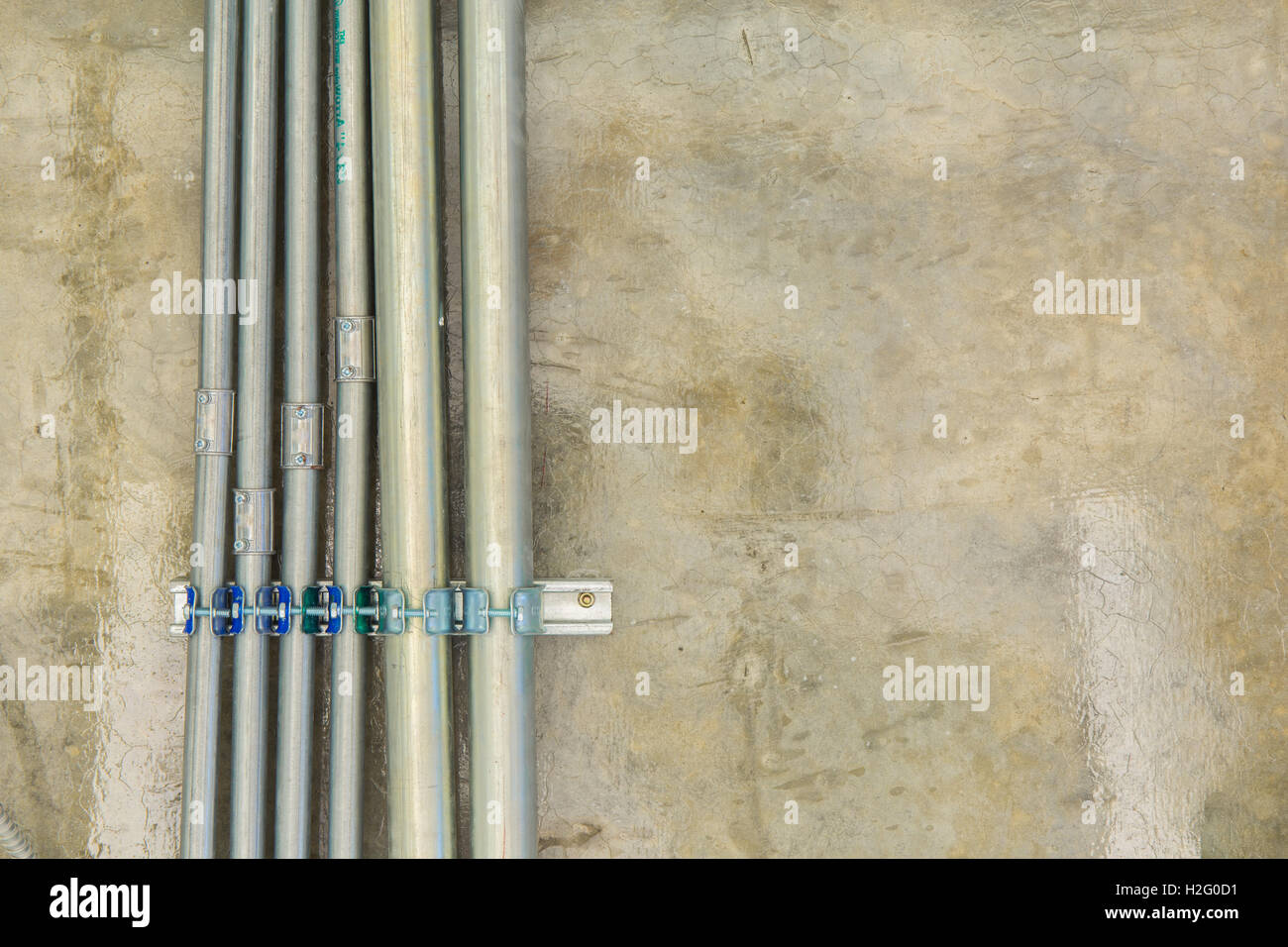 Metal pipes electrical distribution system installation Stock Photo - Alamy