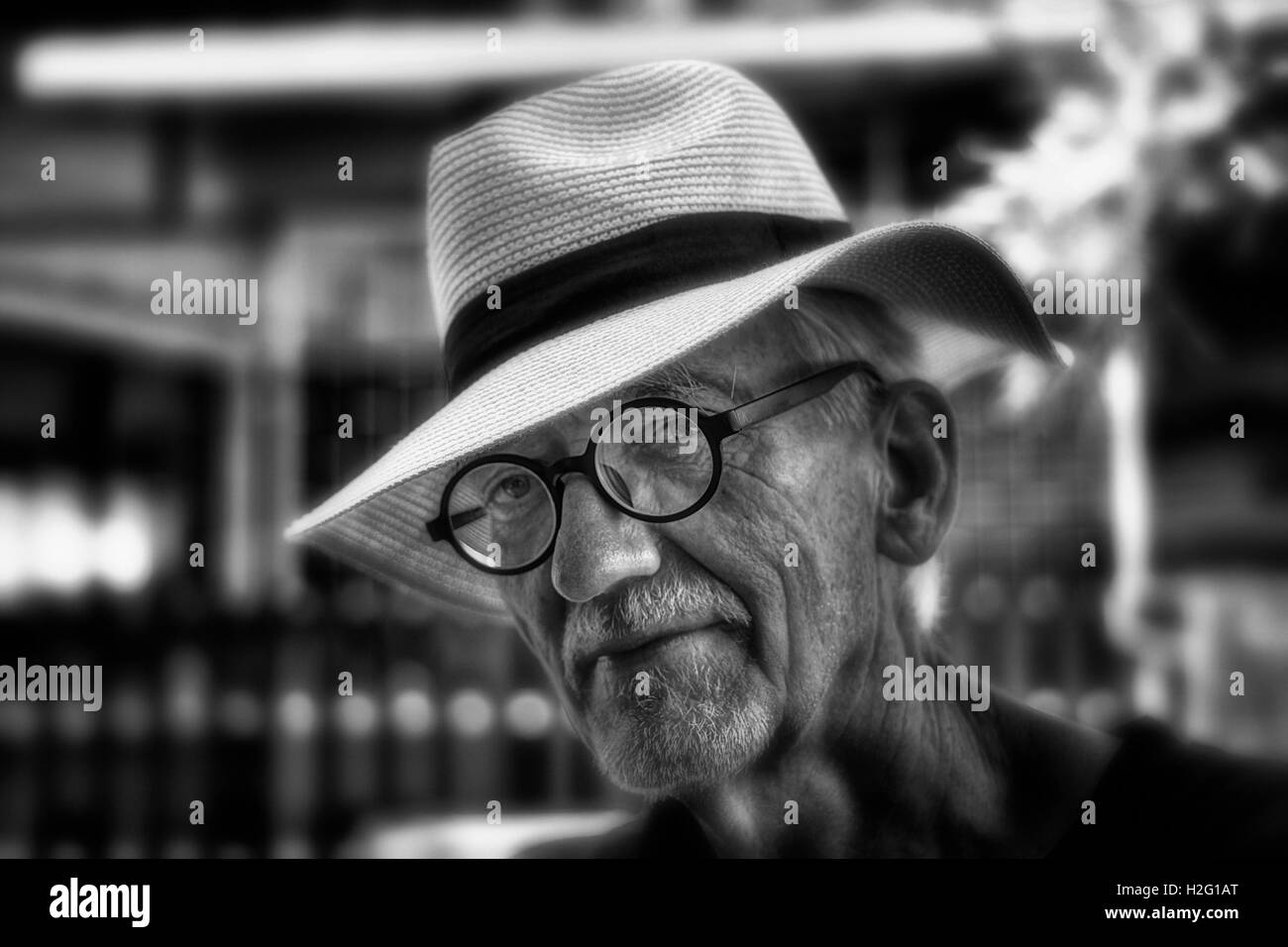 Black and white portrait. Senior male wearing a Panama hat. Black and ...